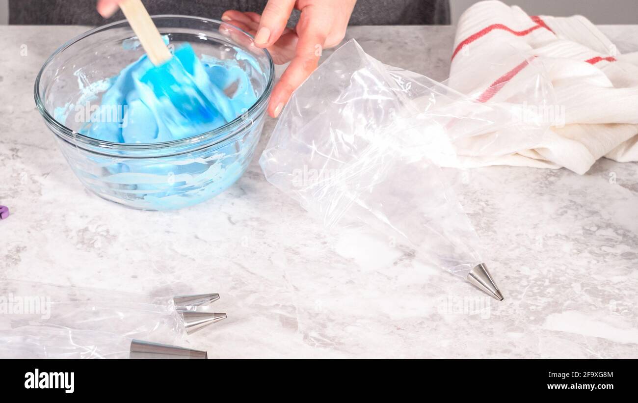 Step by step. Transfering meringue mix into piping bags with metal tips ...