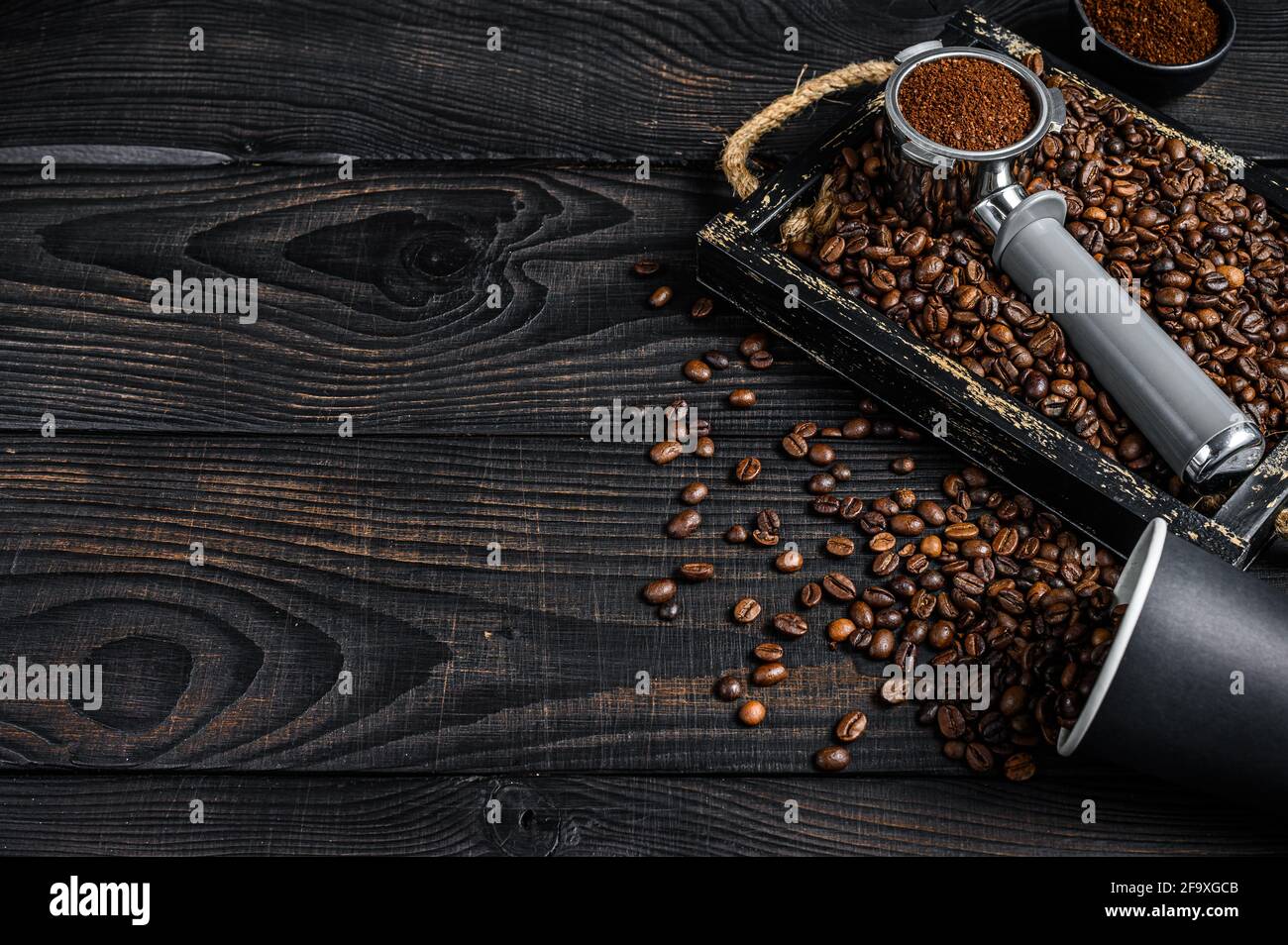 Ground Coffee in Portafilter for Espresso in a wooden tray with coffee ...
