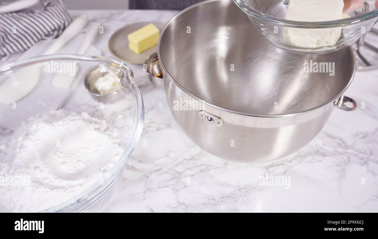 Step by step. Mixing ingredients in a standing kitchen mixer to prepare ...