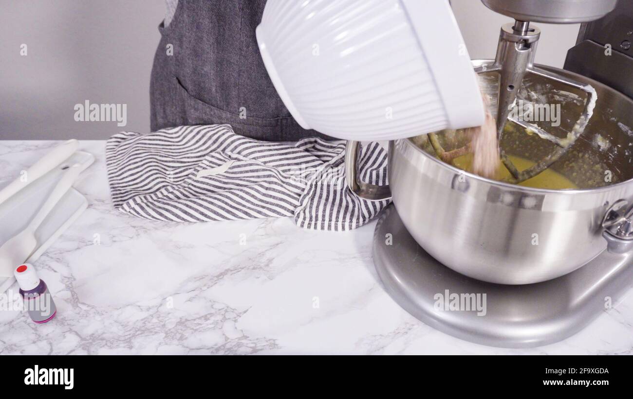 Step by step. Mixing ingredients in a standing kitchen mixer to bake ...