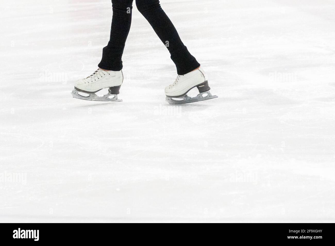 View of figure skater feet at the figure skating practice Stock Photo ...