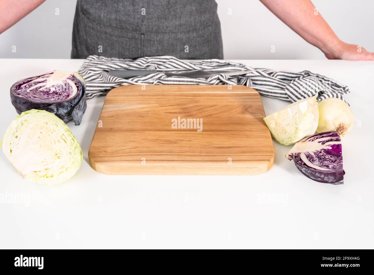 Shredding green cabbage on a wood cutting board Stock Photo - Alamy
