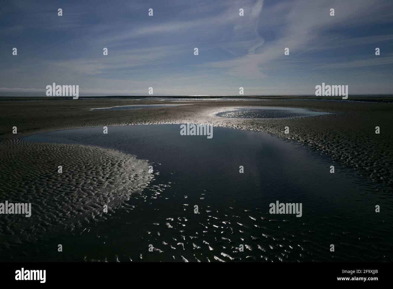 Tidal patterns and reflections at Westward Ho! beach on the North Devon ...