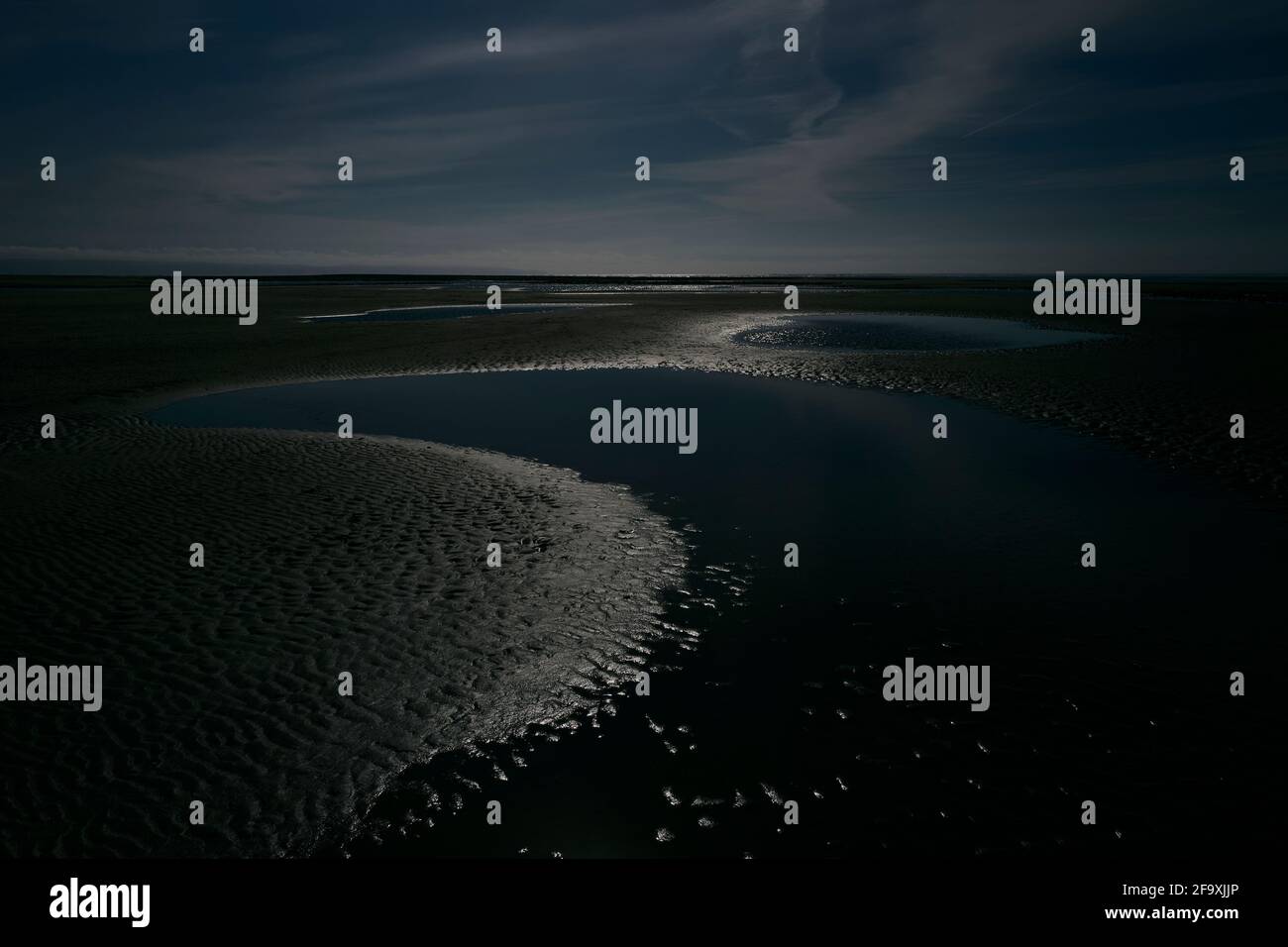 Tidal patterns and reflections at Westward Ho! beach on the North Devon ...
