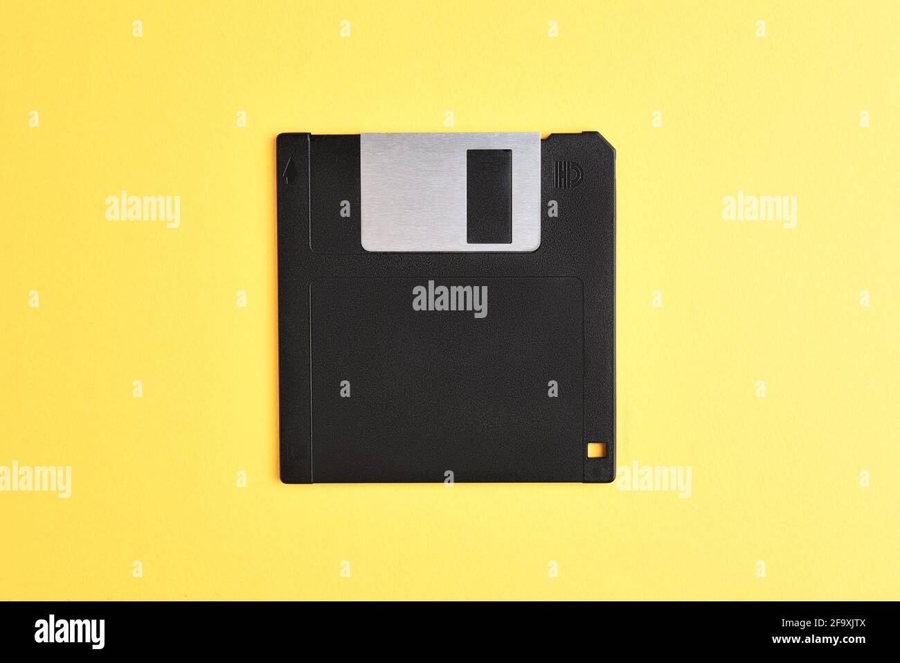 Floppy disk on yellow background. Retro computer diskette Stock Photo ...