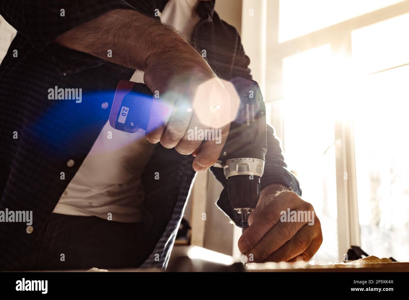 Close up of a carpenter drilling a hole in timber Stock Photo - Alamy