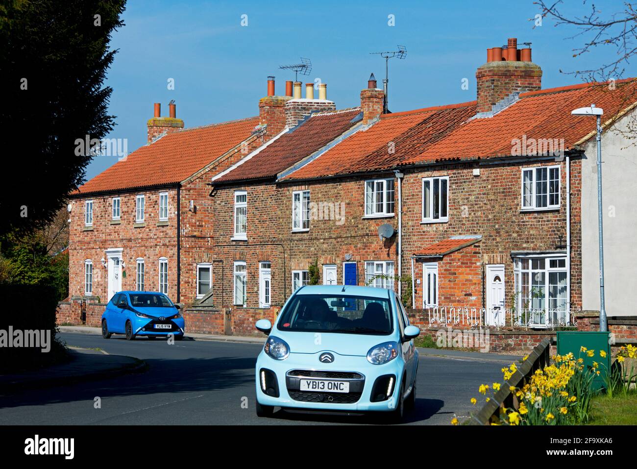 Street of traditional terraced houses in the village of Riccall, North ...