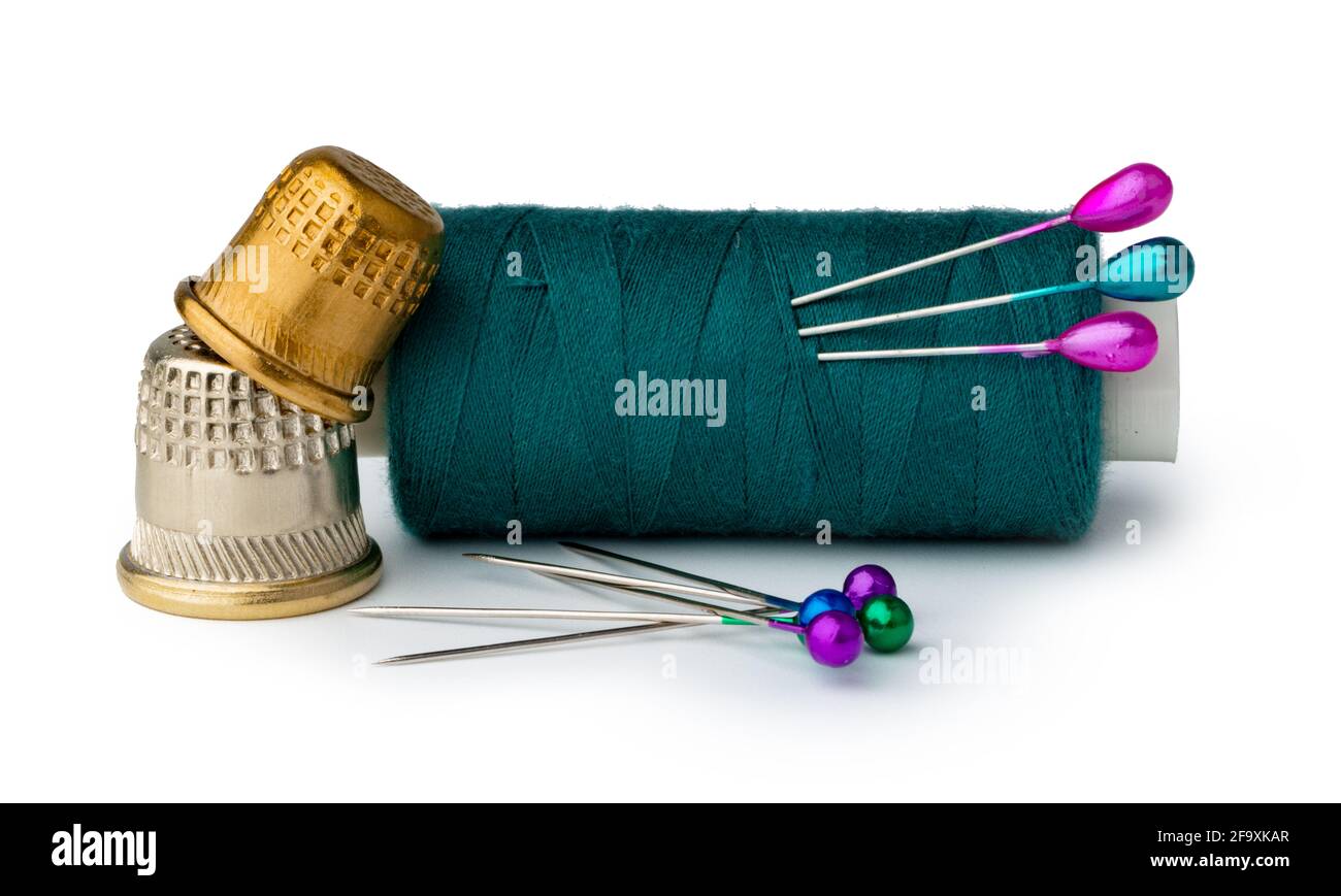 Tailor, needles and threads over white background Stock Photo - Alamy