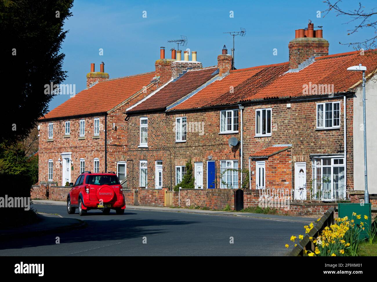Street of traditional terraced houses in the village of Riccall, North ...