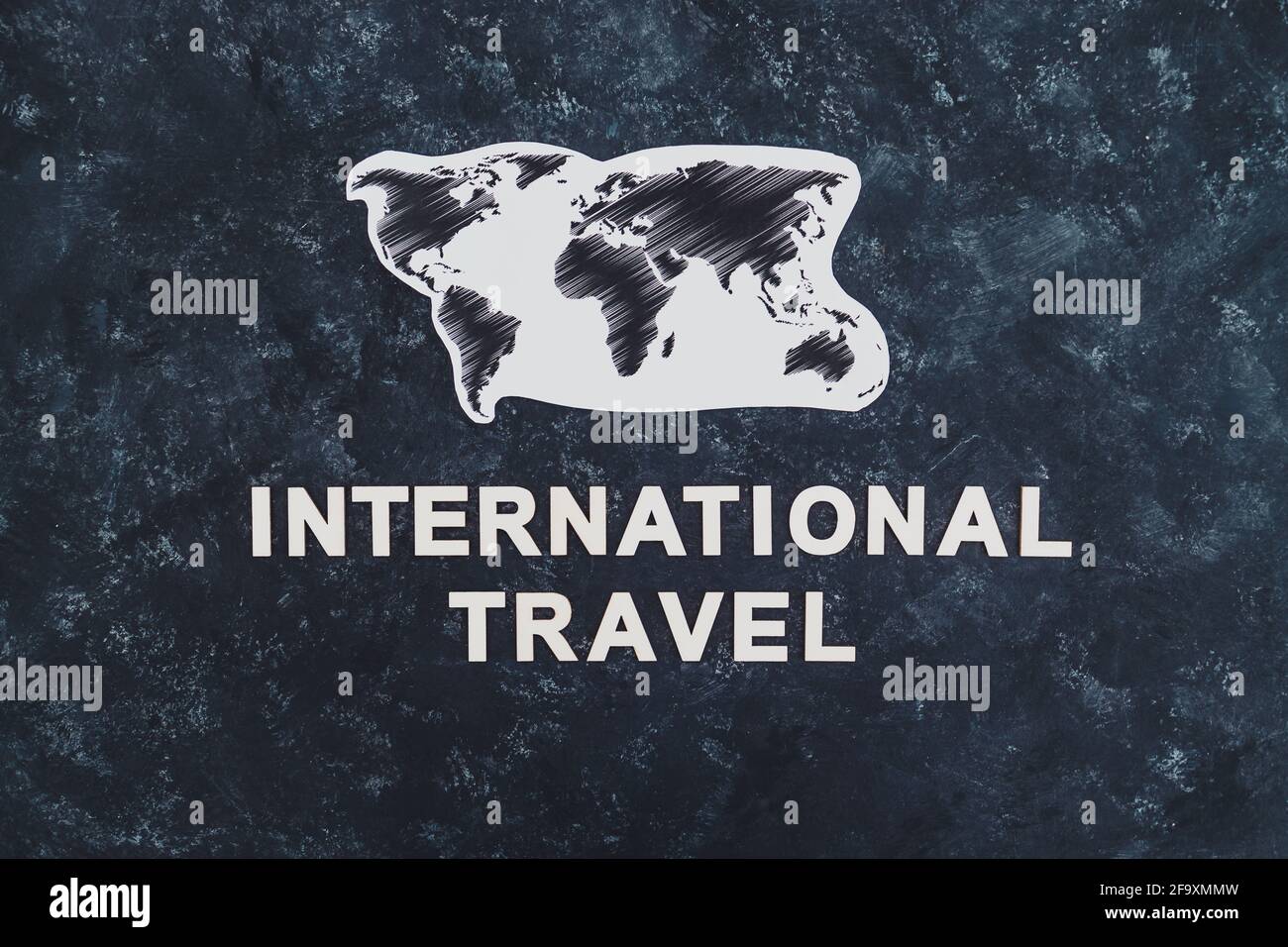 International Travel text with world map on black background, travel ...