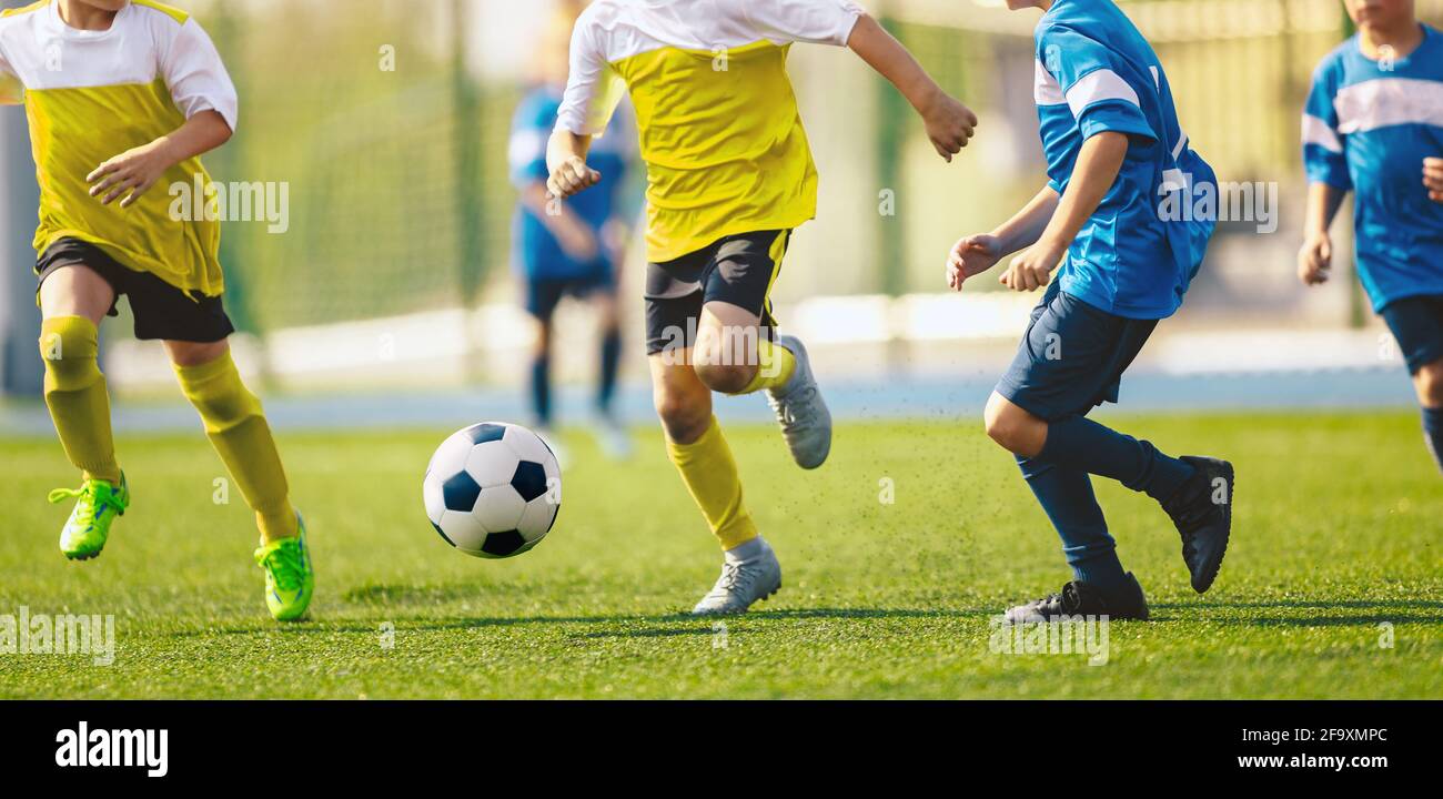 Group of School Boys Playing Football Tournament Match on Stadium. Kids ...