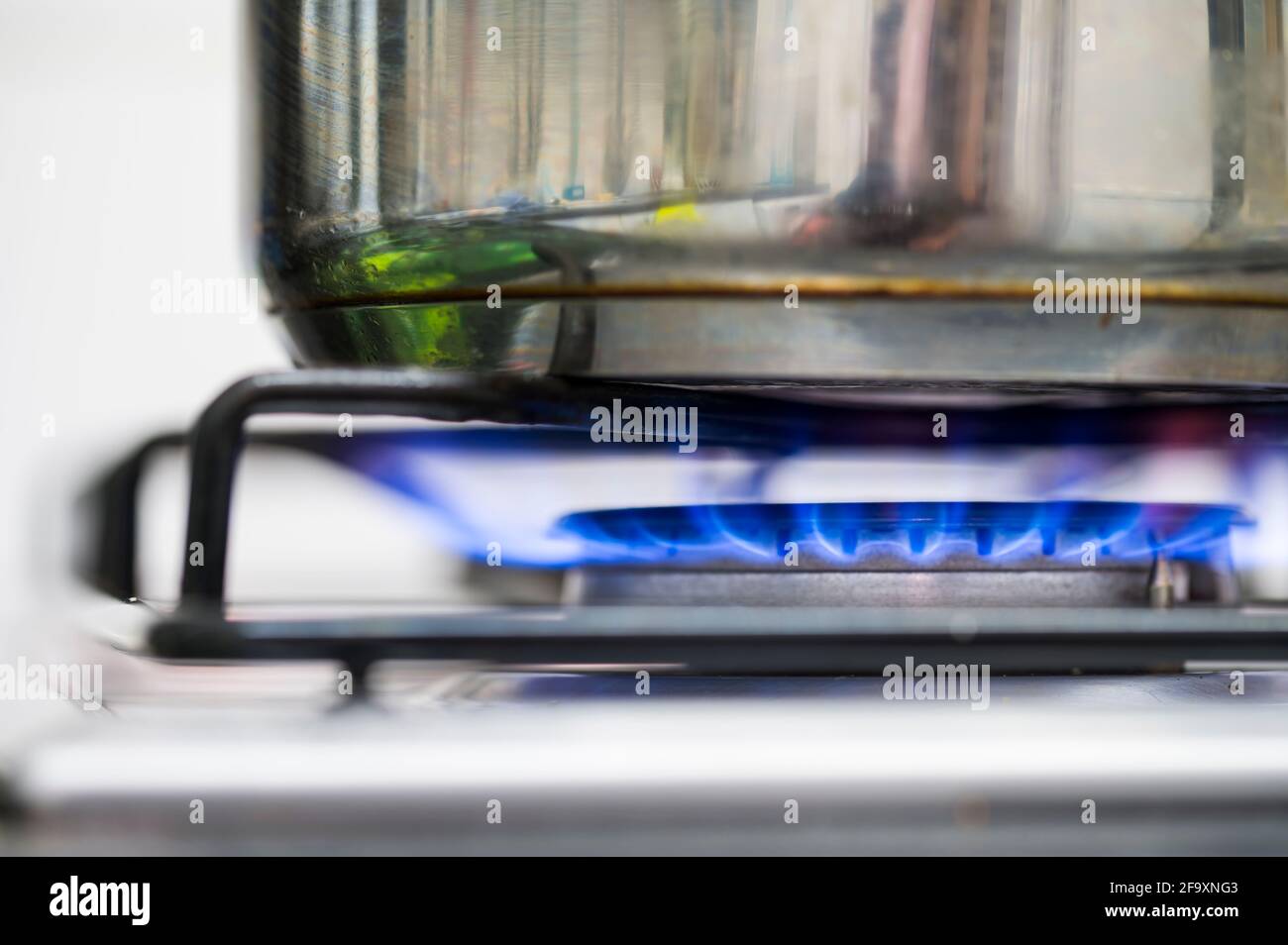 A pot on a gas stove while cooking Stock Photo - Alamy