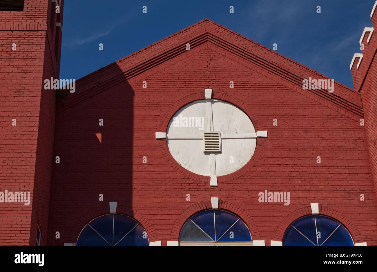 Top view intricate brick work on a building with blue windows and a ...
