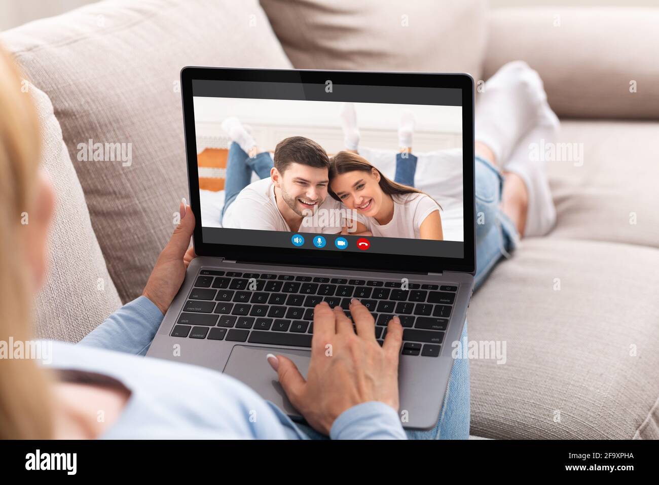 Online Call. Woman Sitting On Couch With Laptop Video Chatting With ...