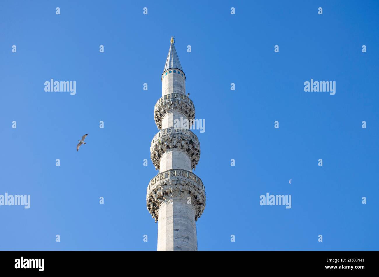 Tower mosque in Istanbul attraction against blue sky Stock Photo - Alamy