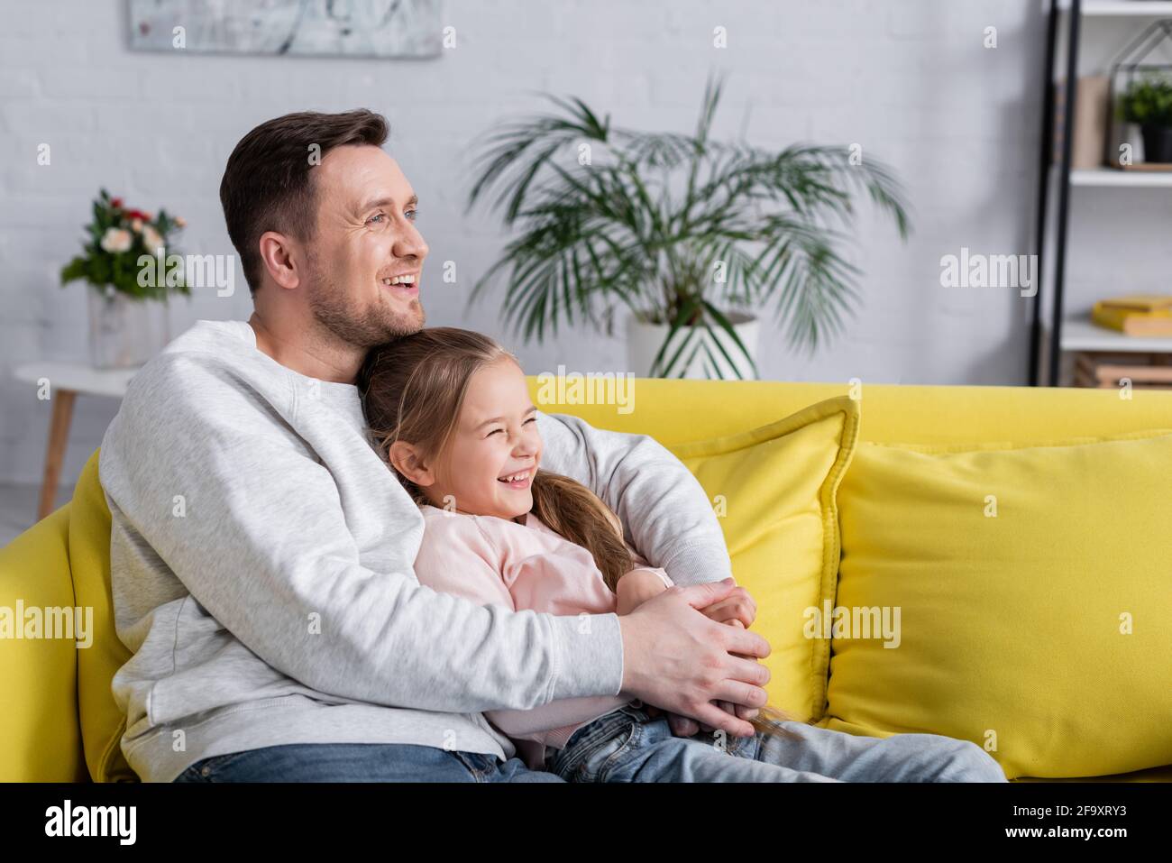 Happy kid sitting near hi-res stock photography and images - Alamy