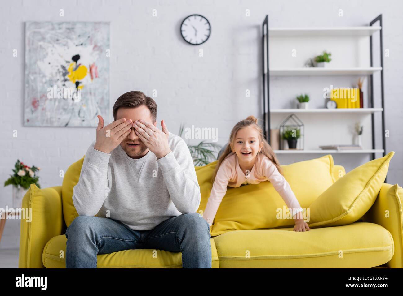 Girl covering eyes father eyes hi-res stock photography and images - Alamy