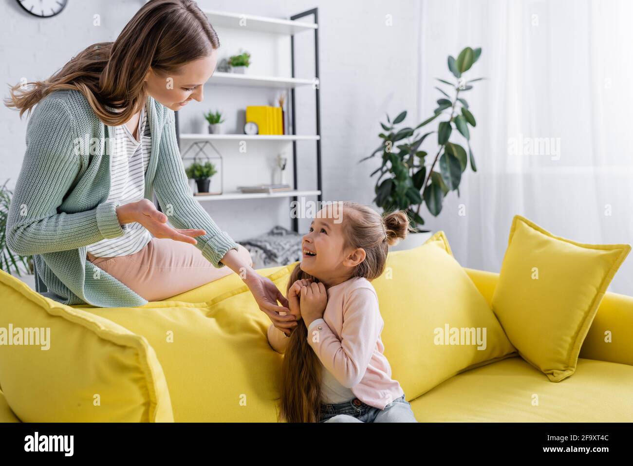 Positive mom daughter talking on hi-res stock photography and images ...