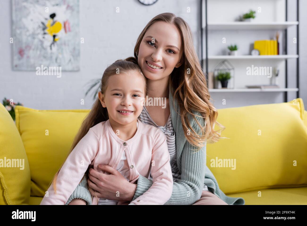Woman hugging child hi-res stock photography and images - Alamy
