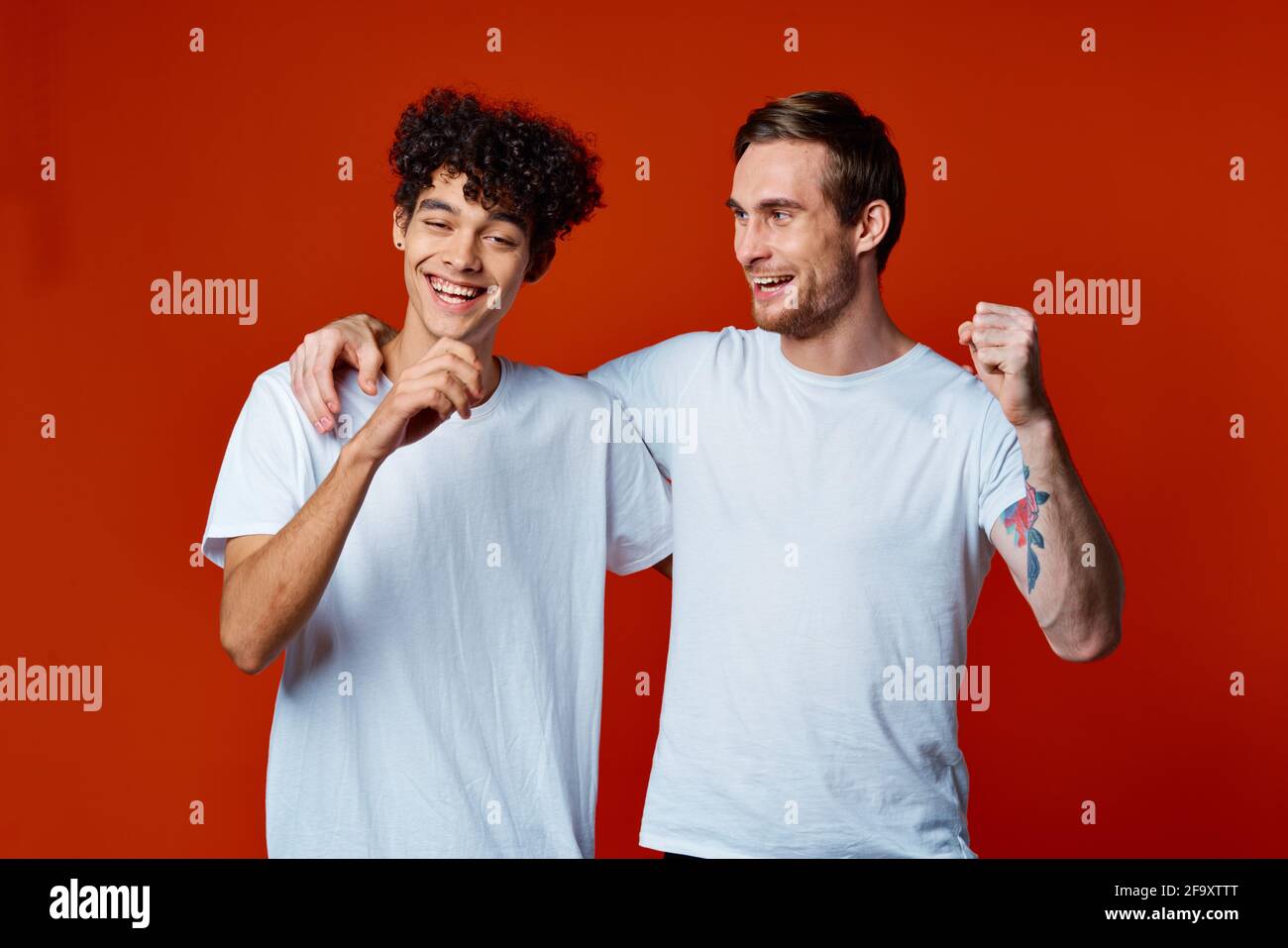 Two cheerful brothers pointing hi-res stock photography and images - Alamy