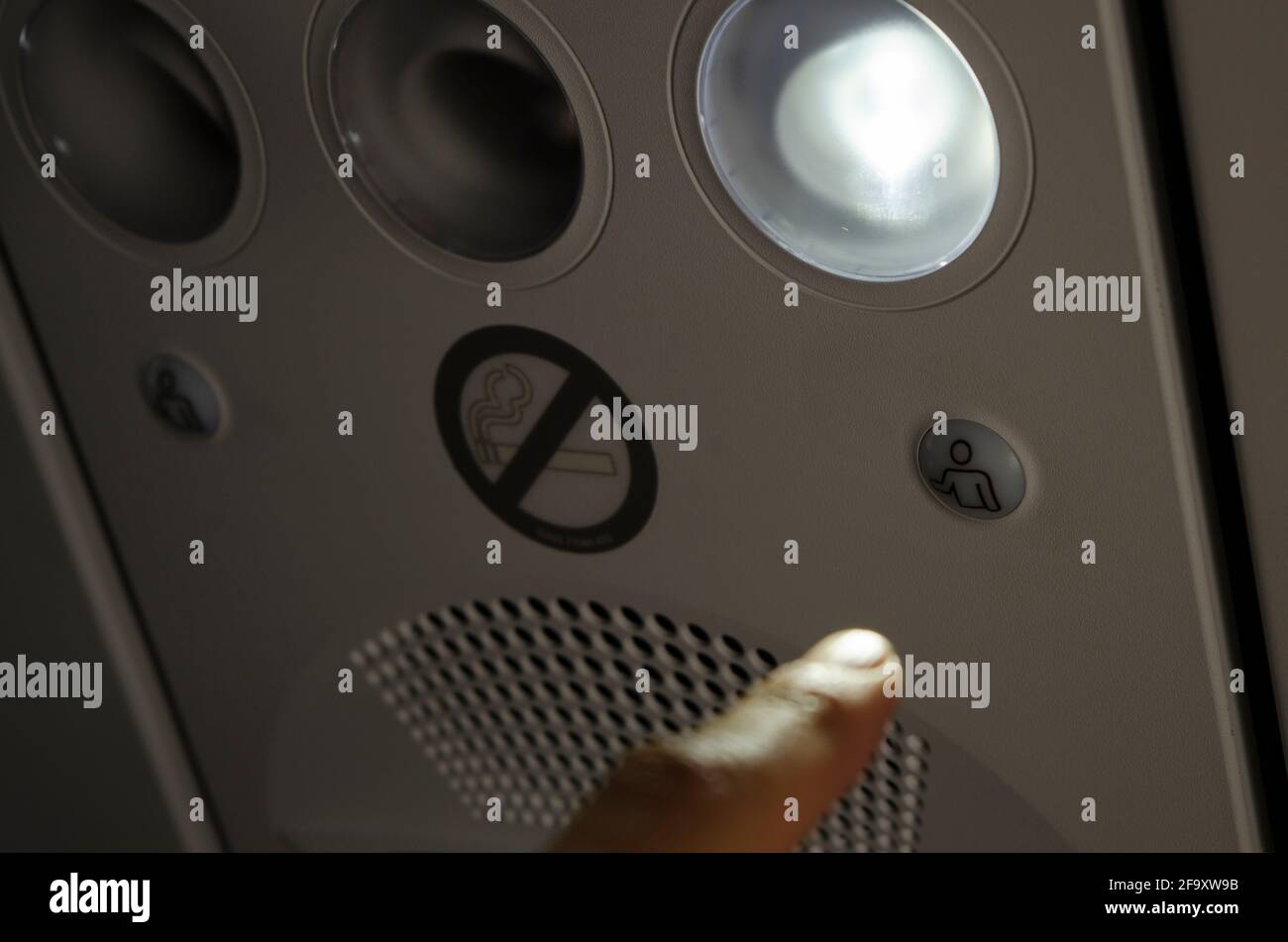 person for pressing the button to call the passenger on a plane, or ...