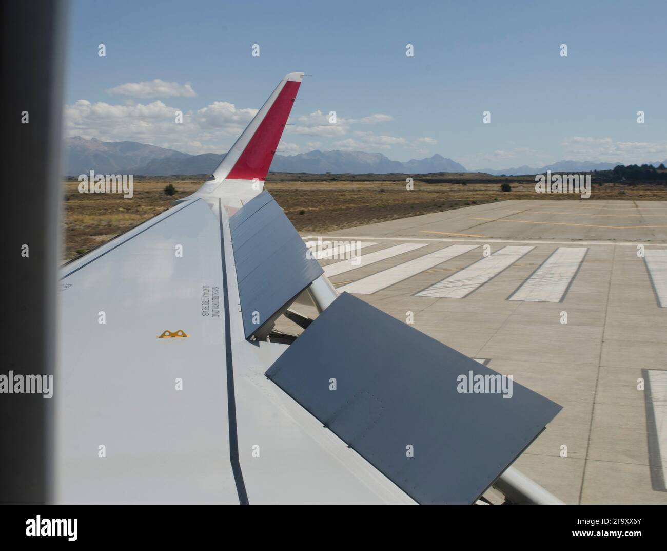 view of airplane wing and runway, aircraft just landed Stock Photo - Alamy