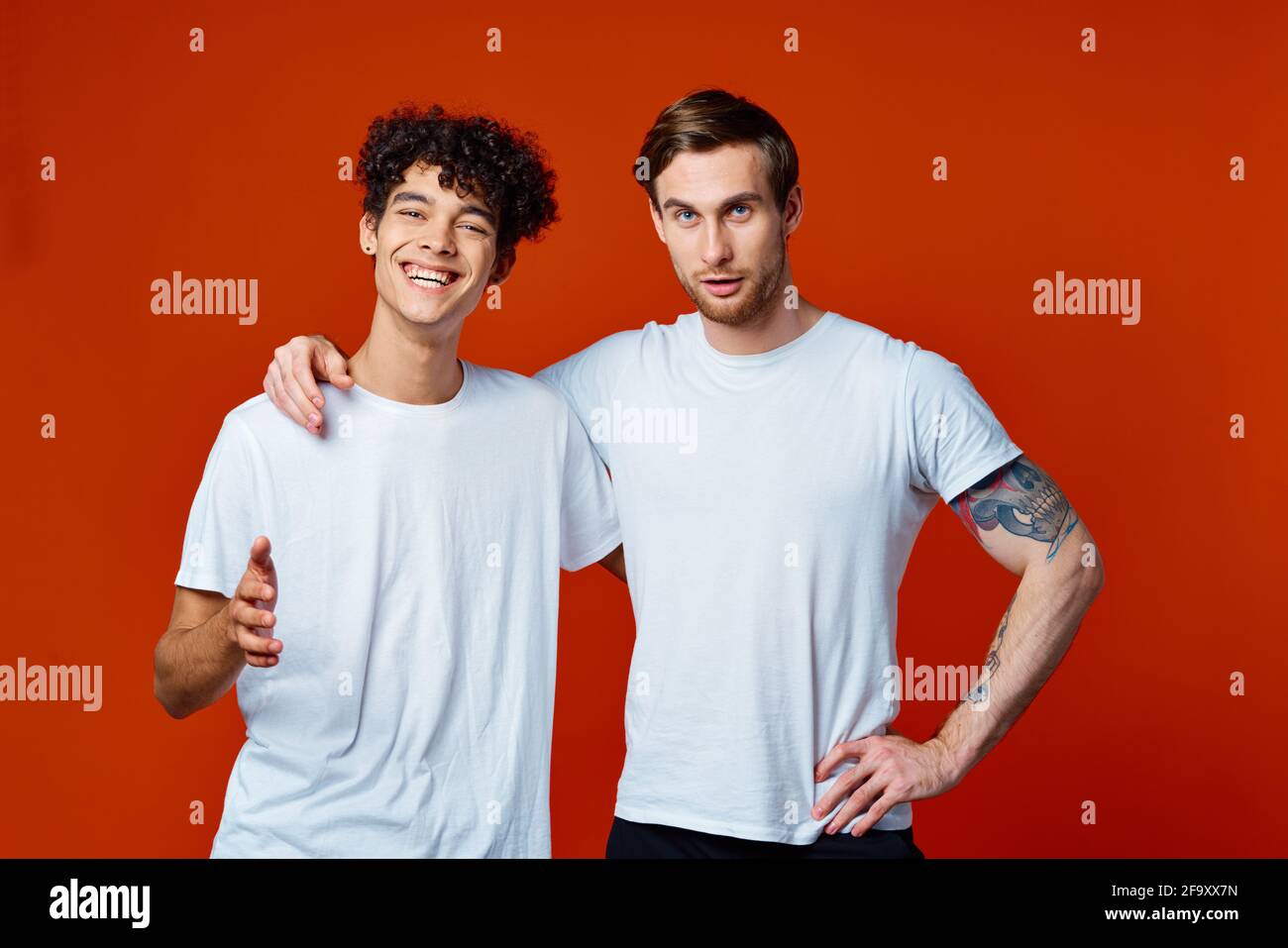 Two handsome brothers stand hi-res stock photography and images - Alamy