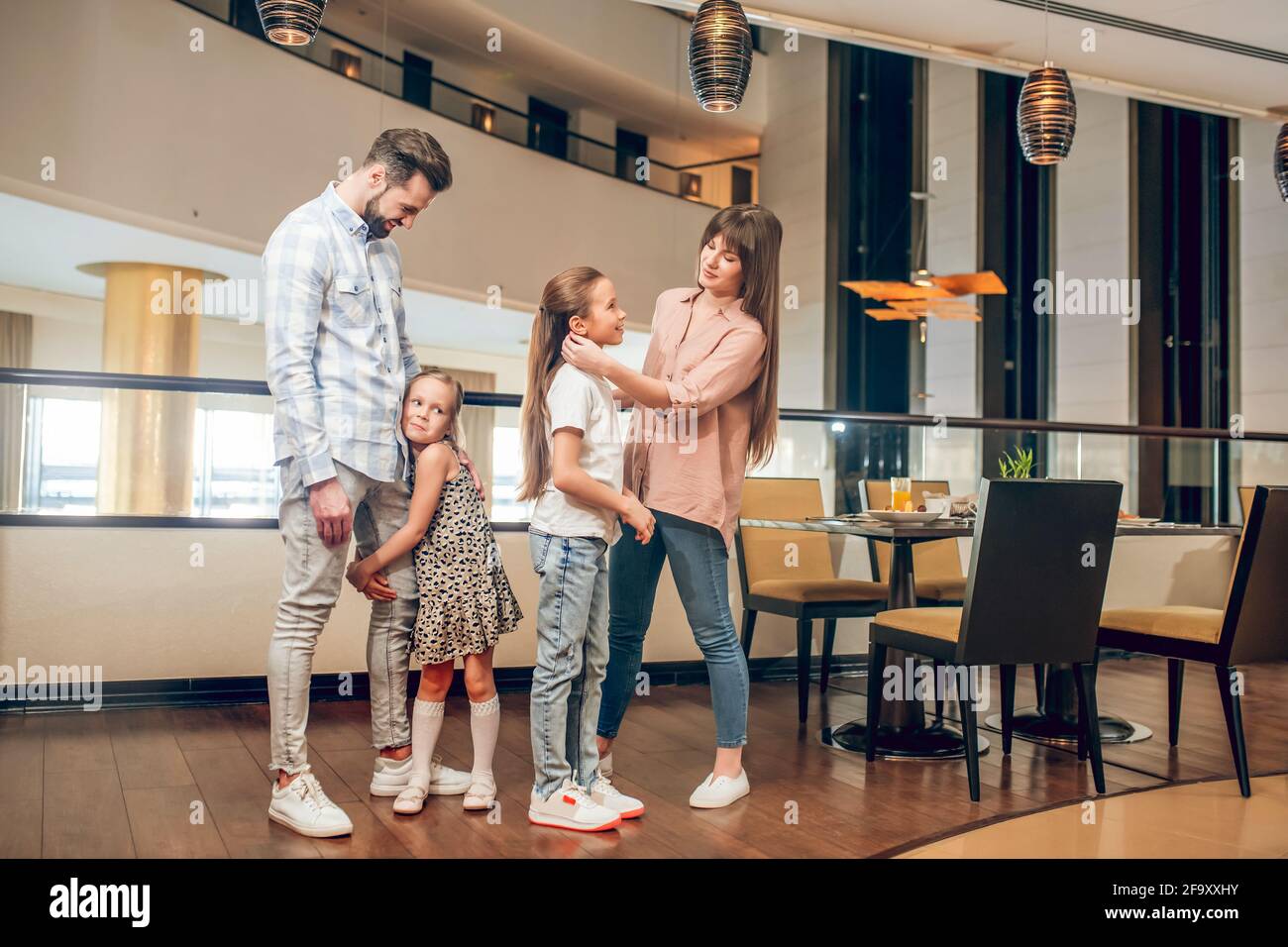 Two girls and their parents in the hotel Stock Photo - Alamy