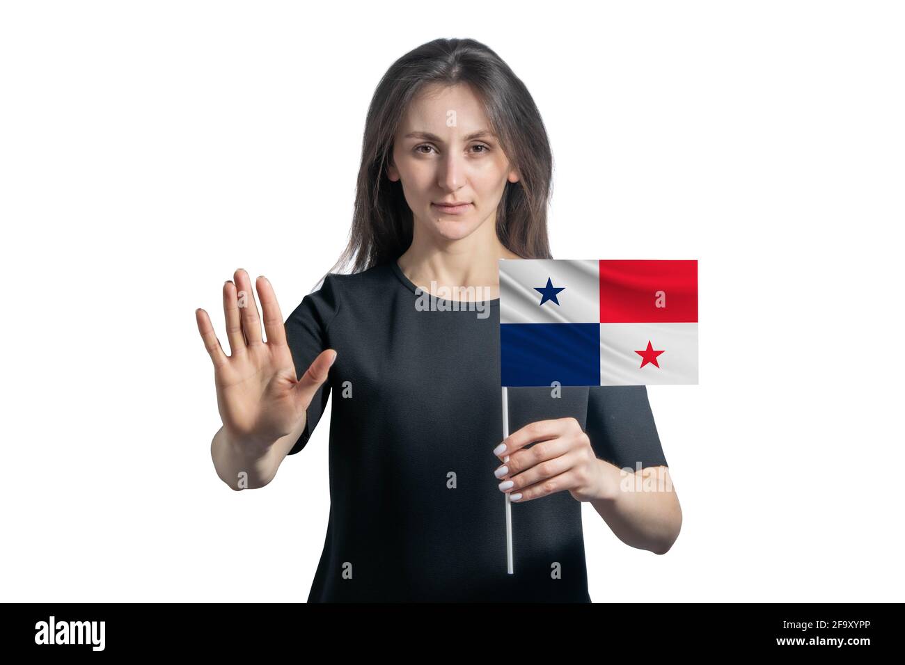 Happy young white woman holding flag of Panama and with a serious face ...