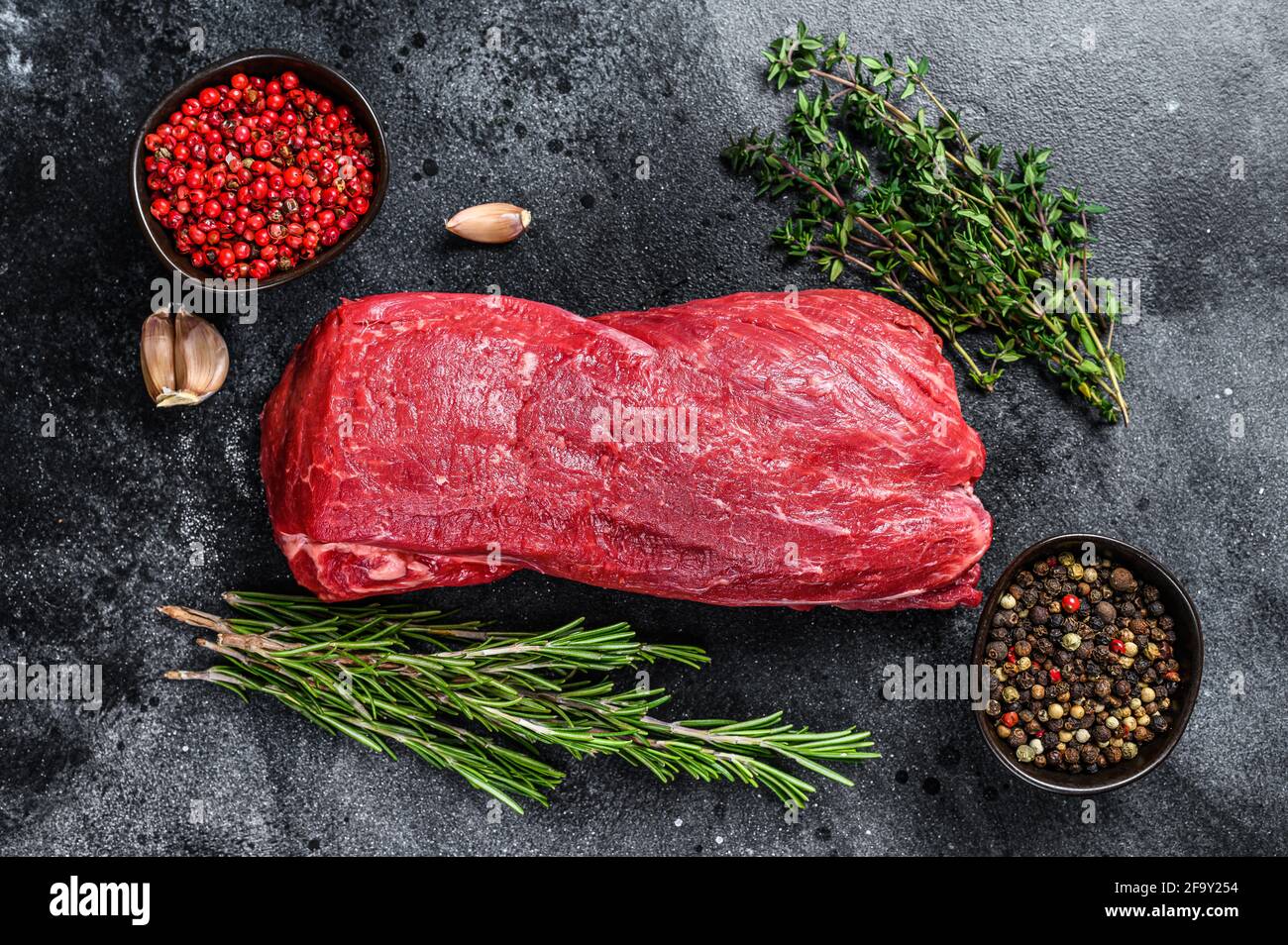 Raw fillet Tenderloin beef meat for steaks with thyme and rosemary ...