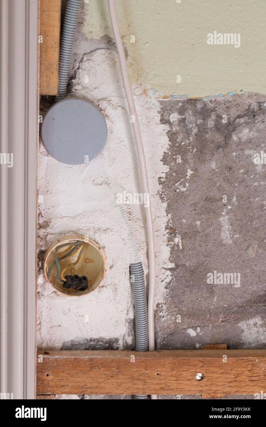 Electricity work in the wall of an house Stock Photo - Alamy