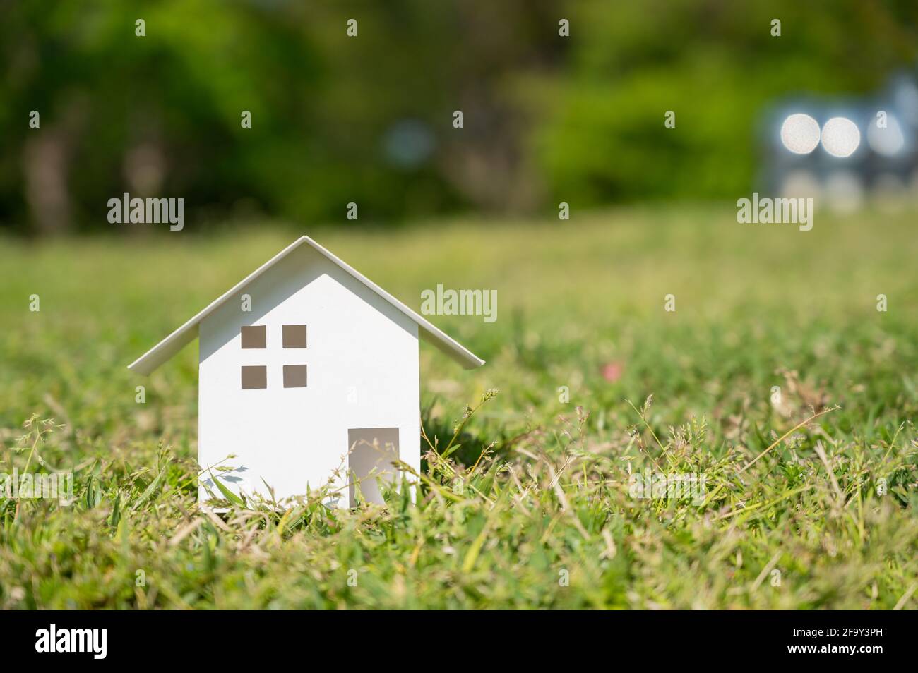White paper house on the lawn with copy space on the right Stock Photo ...