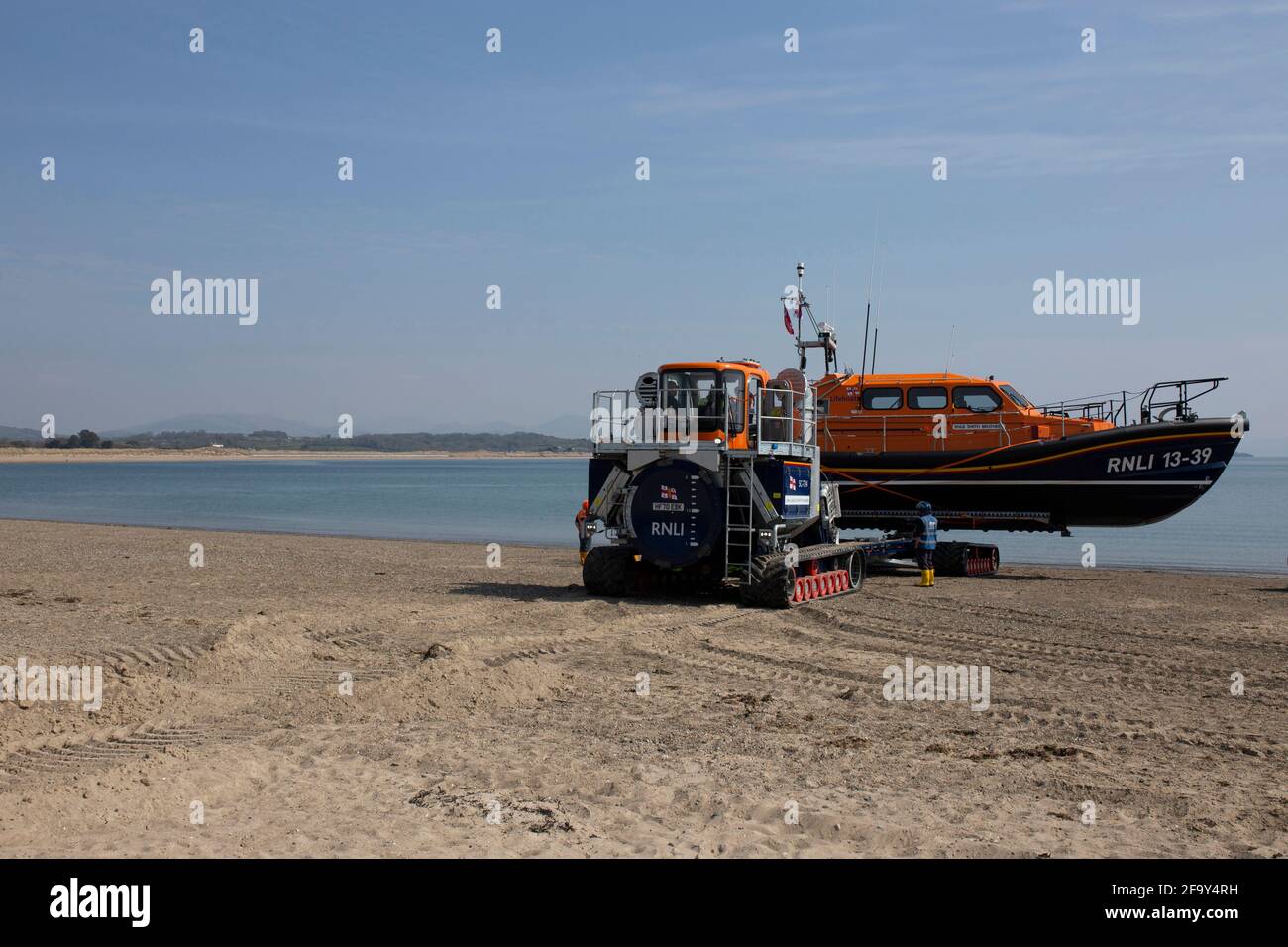 RNLI Shannon class lifeboat being transported by trailer on the beach ...