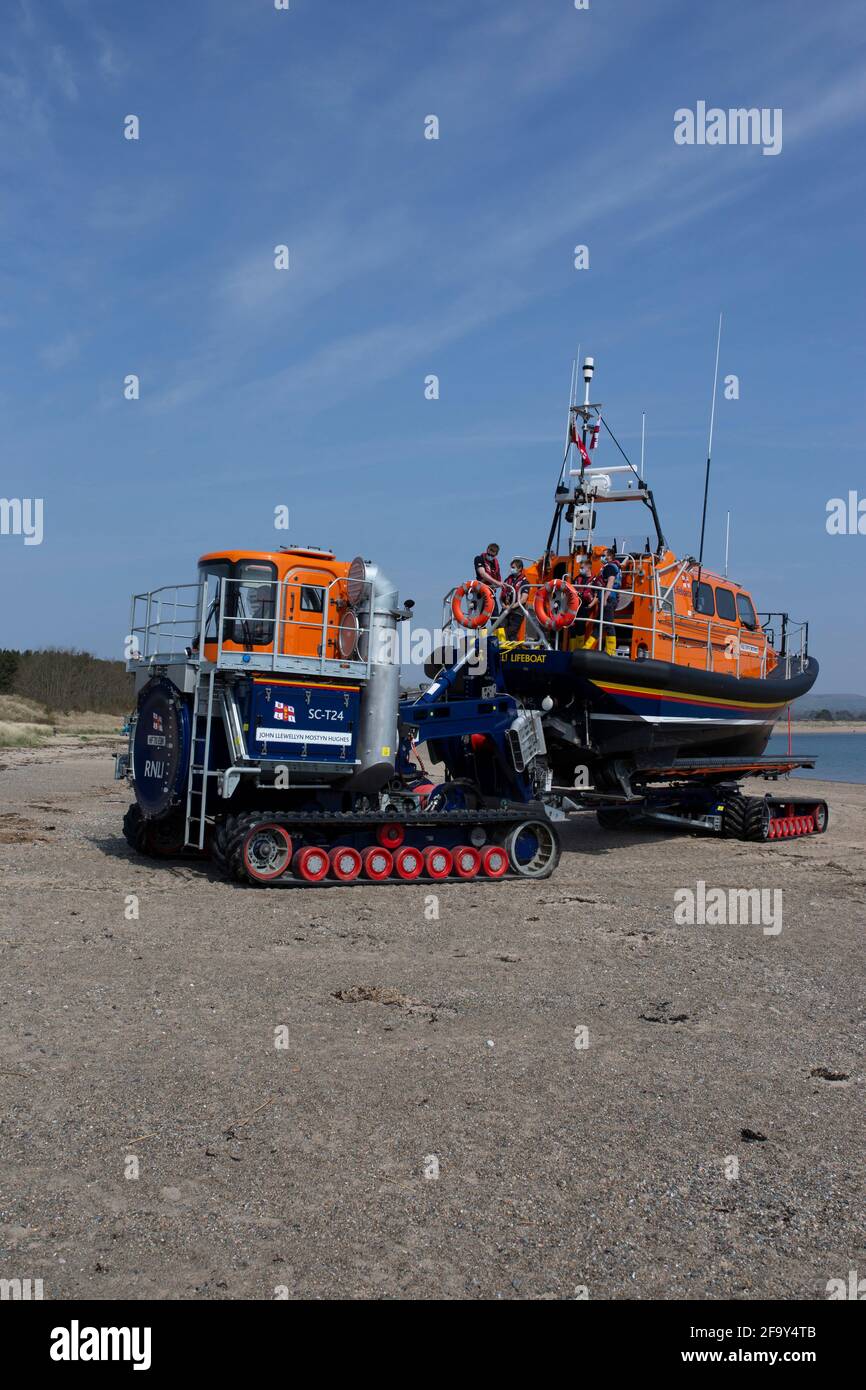 RNLI Shannon class lifeboat being transported by trailer on the beach ...