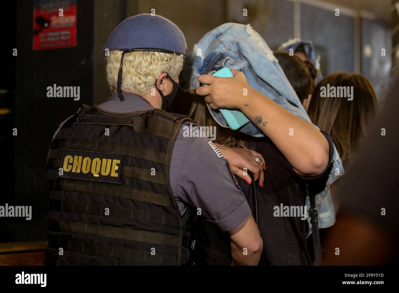 Sao Paulo, Sao Paulo, Brazil. 21st Apr, 2021. A woman is searched by a ...