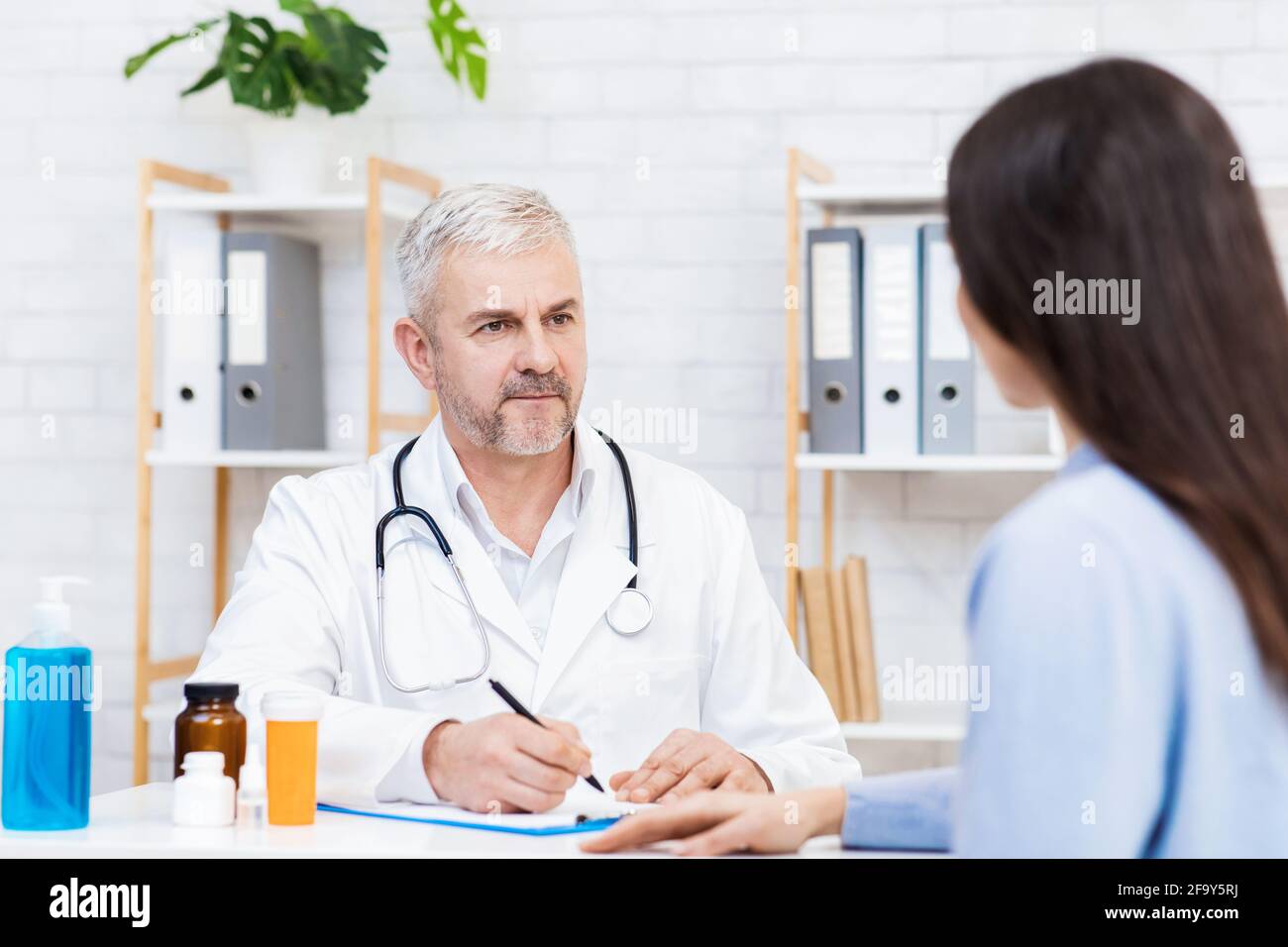 Regular checkup examine in modern clinic, family doctor and ...