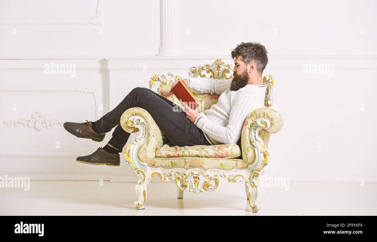 Intelligent concept. Macho smart spends leisure with book. Scientist ...