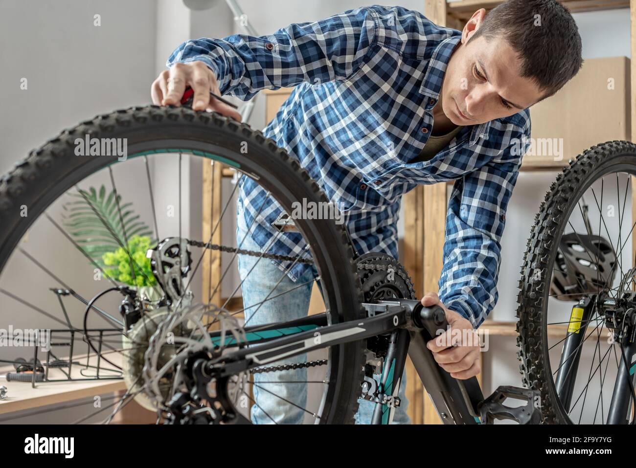 Male cyclist repairing mountain bike hi-res stock photography and ...
