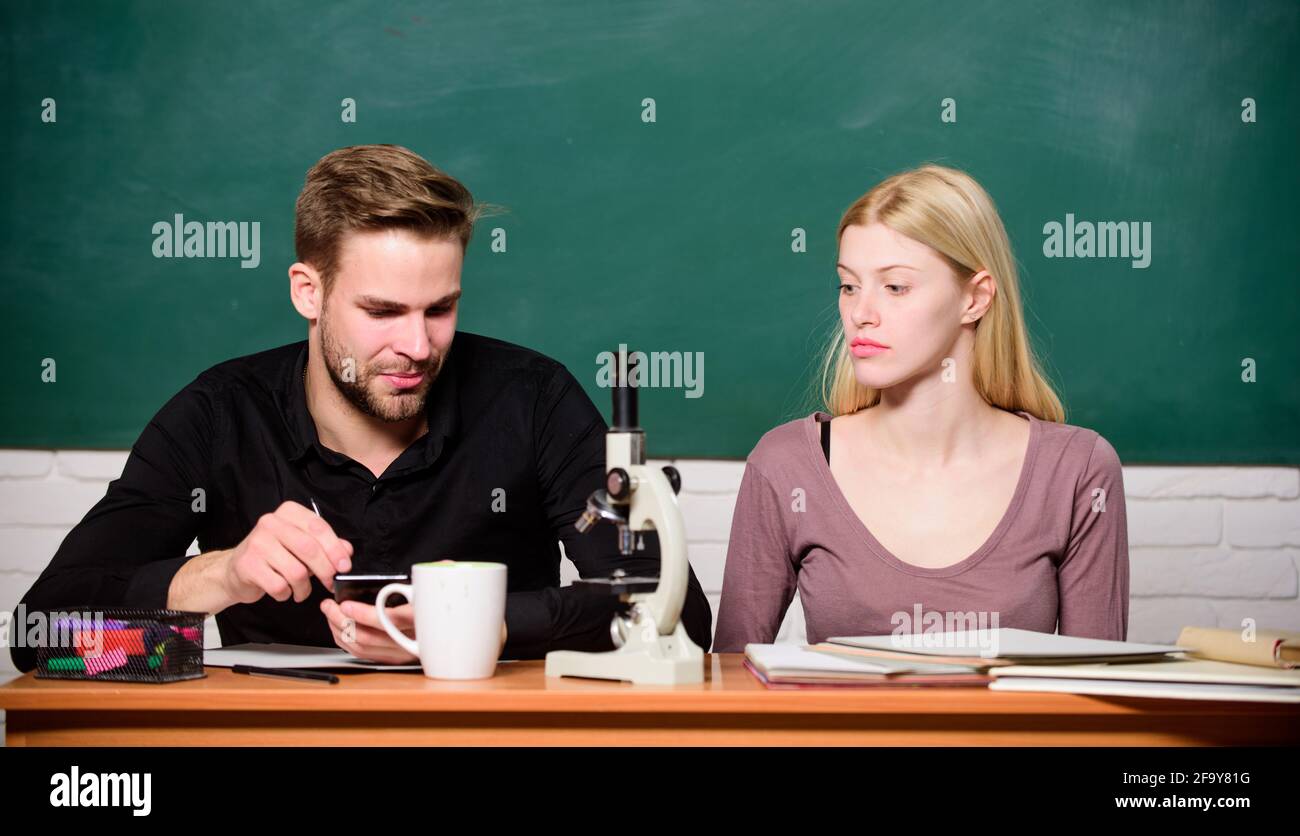 Studying in college or university. Biology lesson. Students studying ...