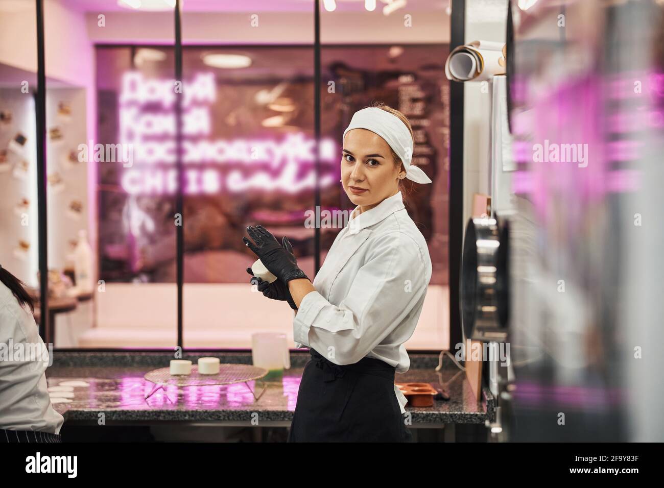 Professional chef posing at her cafe workplace Stock Photo - Alamy