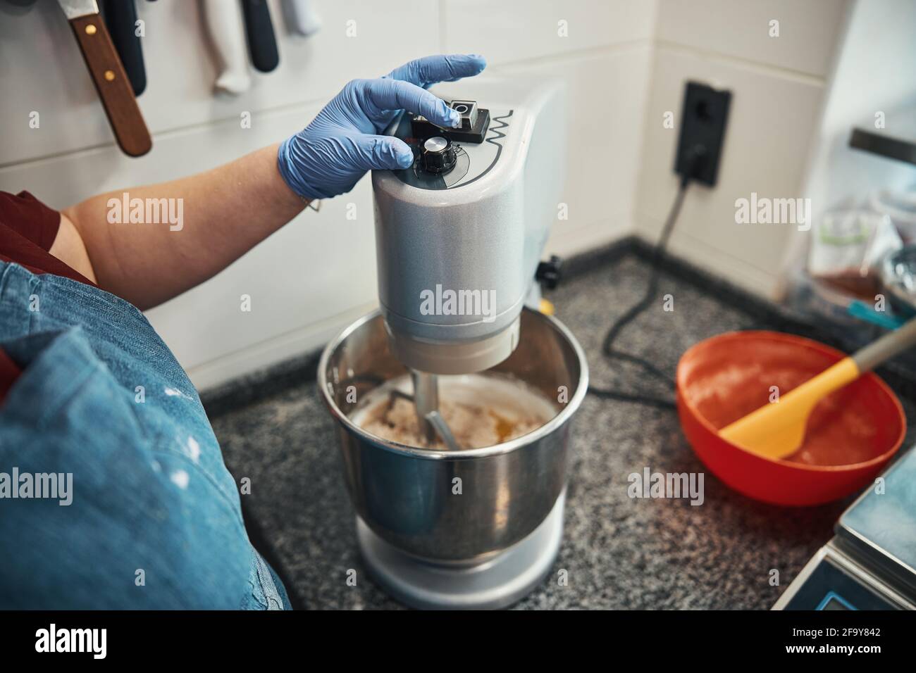 Professional chef preparing light-brown mixture in blender Stock Photo ...