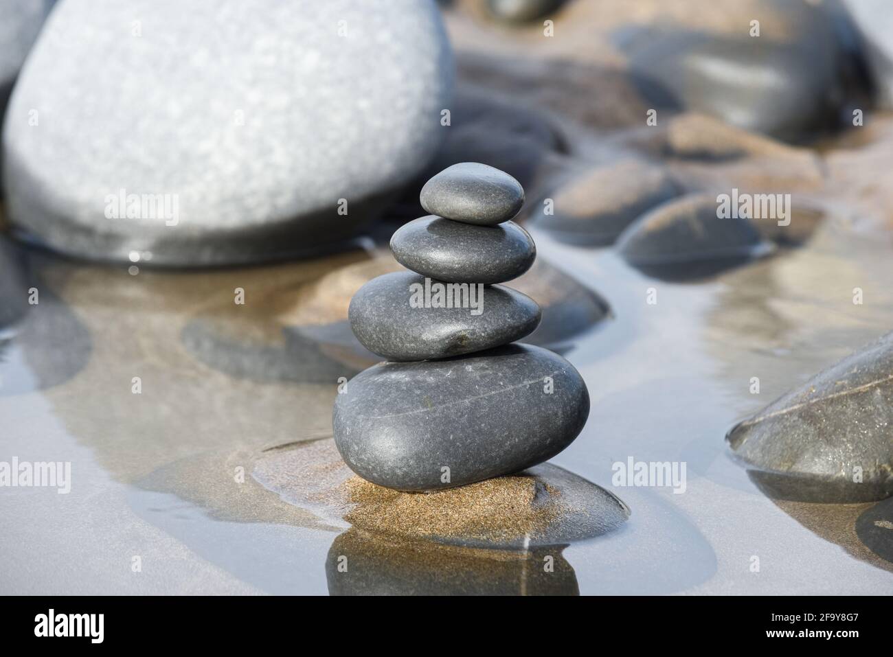 Pebble stack on the beach the stones represent balance and wellbeing of ...