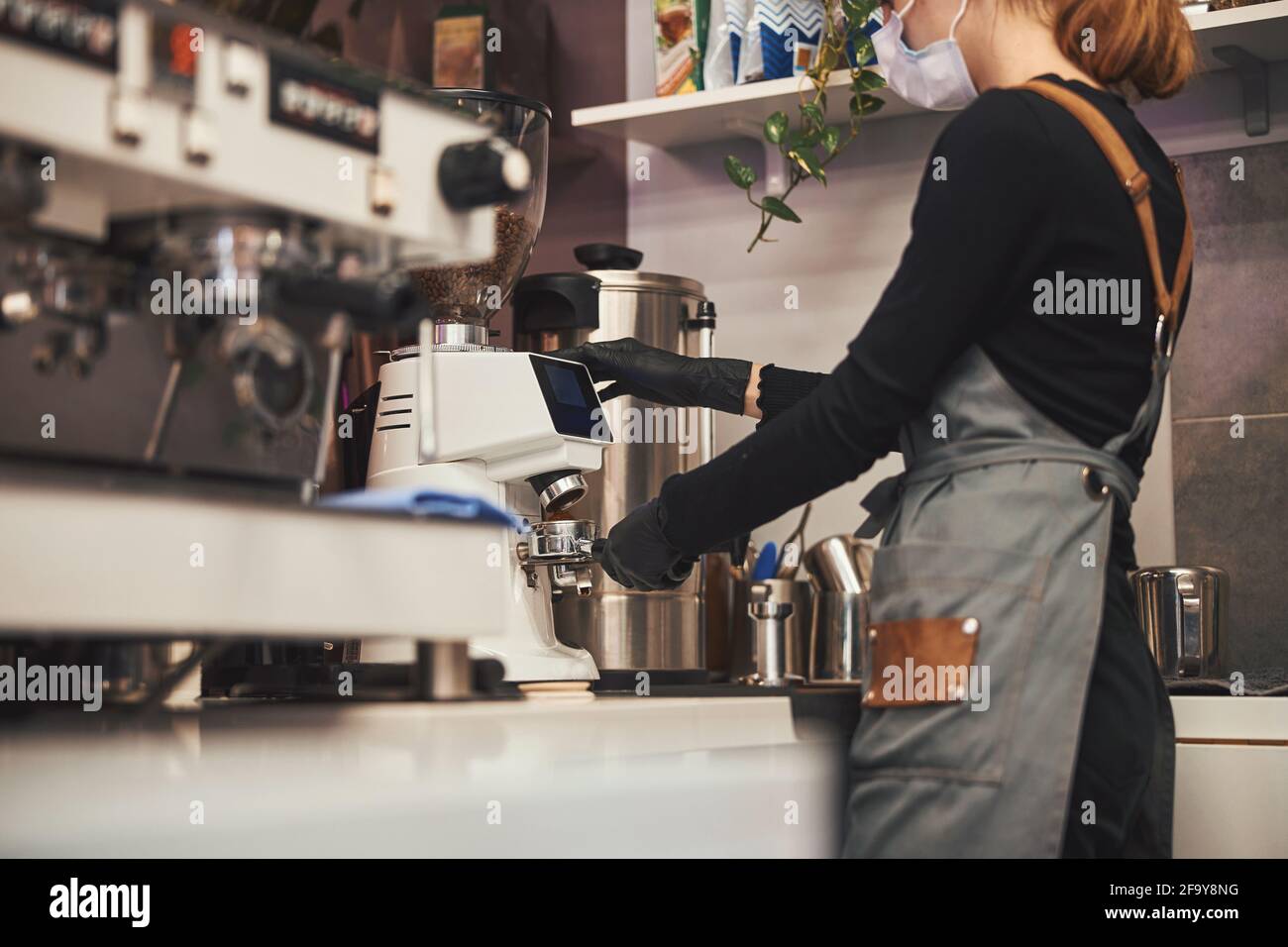 Hard-working barista preparing a good cup of coffee Stock Photo - Alamy
