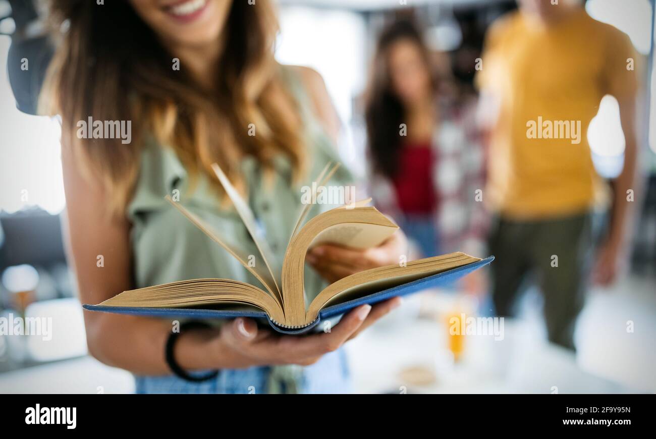 Happy group of young students studying together Stock Photo - Alamy