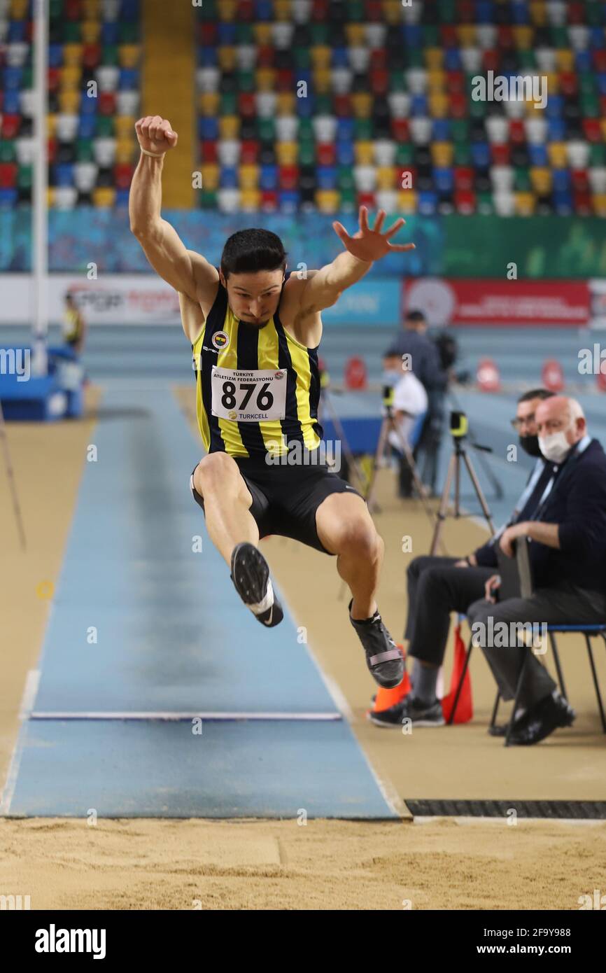 ISTANBUL, TURKEY - FEBRUARY 23, 2021: Undefined athlete long jumping ...