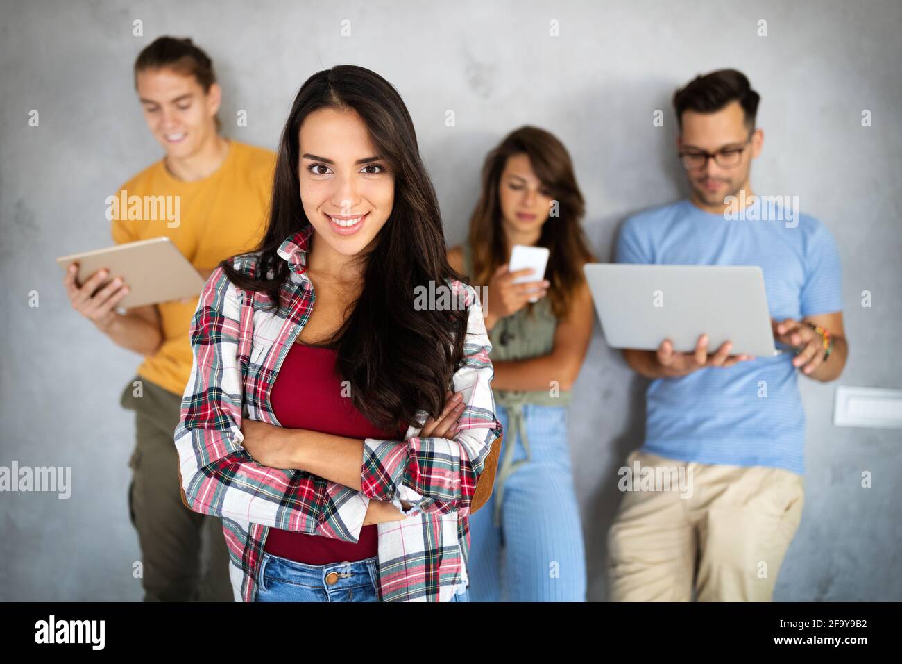 Group of happy friends, people smiling and connected by digital devices ...