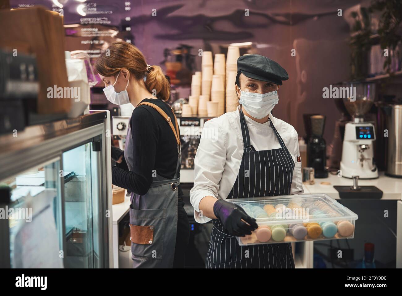 Busy cafe workers running errands at a nice espresso bar Stock Photo ...