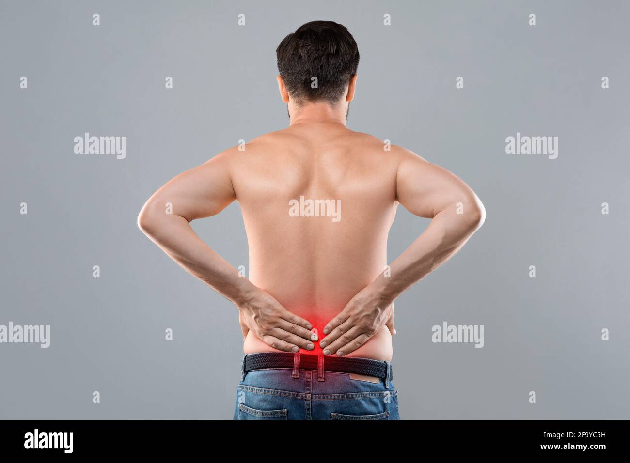 Man holding his hands behind his back, back view Stock Photo - Alamy