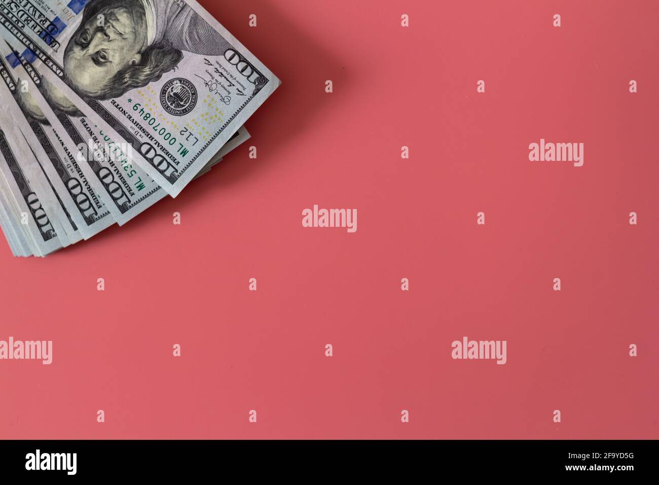 Flat closeup of dollars on pink background. Investment profit income ...