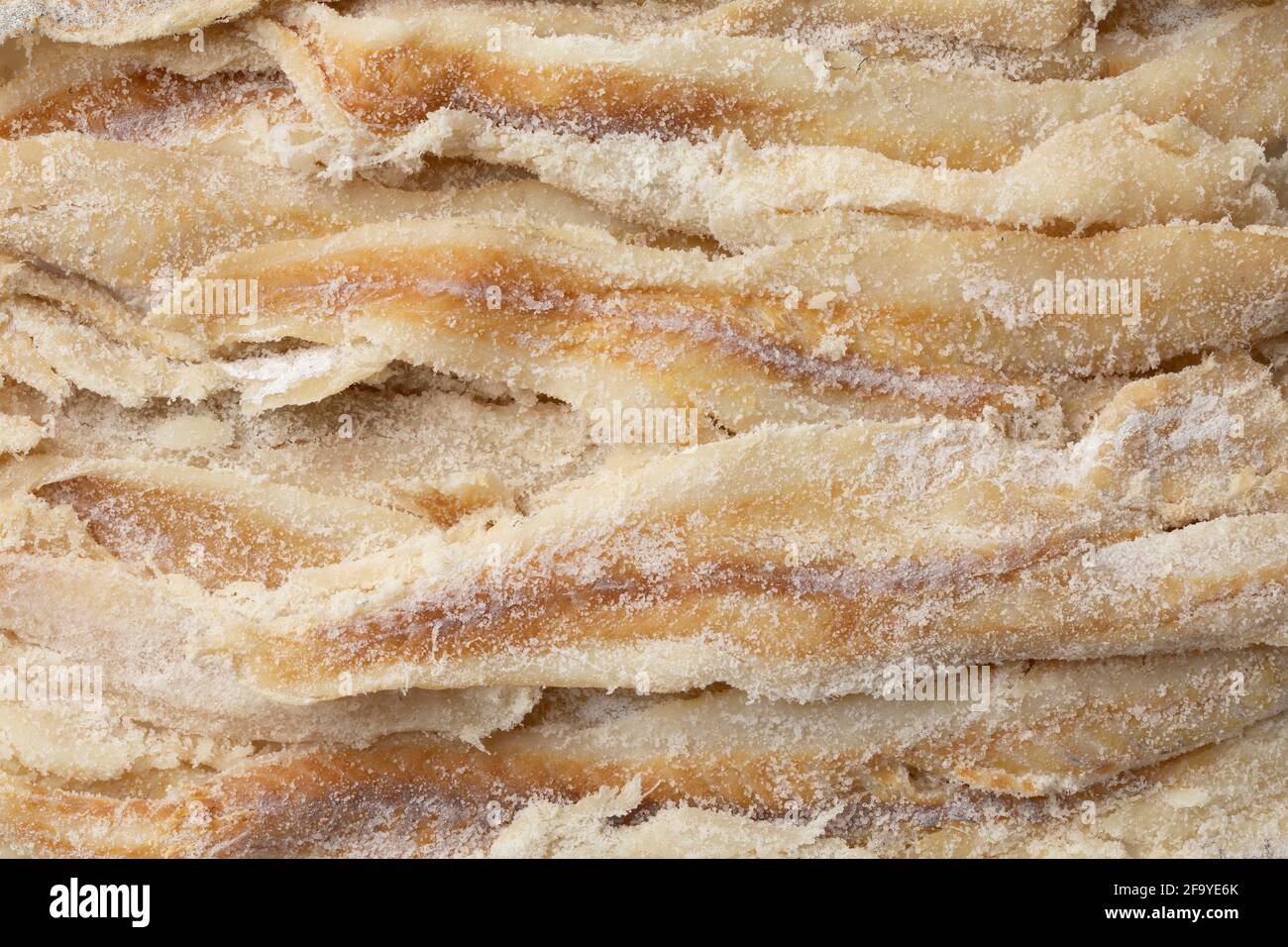 Dried and salted cod full frame close up as background Stock Photo - Alamy